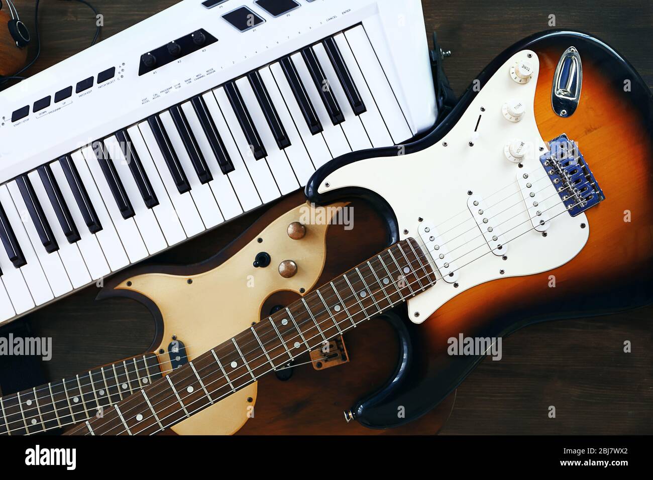 Electric guitars and synthesizer closeup Stock Photo - Alamy