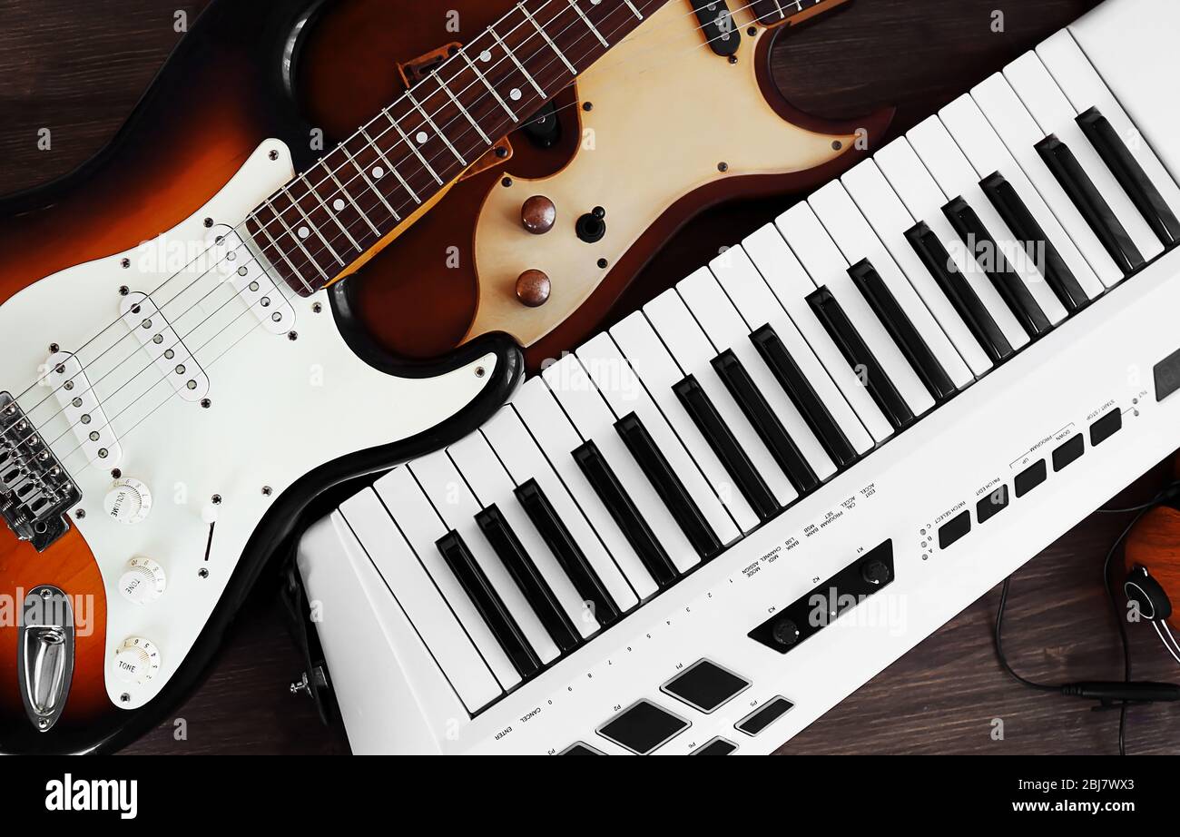 Electric guitars and synthesizer closeup Stock Photo - Alamy