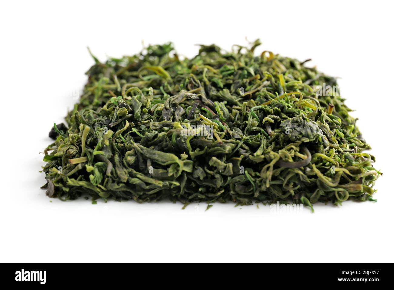 Pile of green dry tea, isolated on white Stock Photo - Alamy