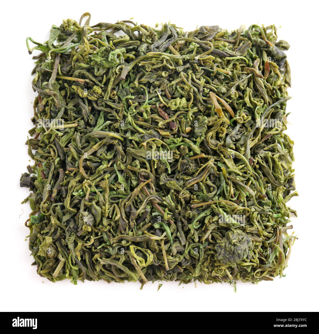 Pile of green dry tea, isolated on white Stock Photo - Alamy