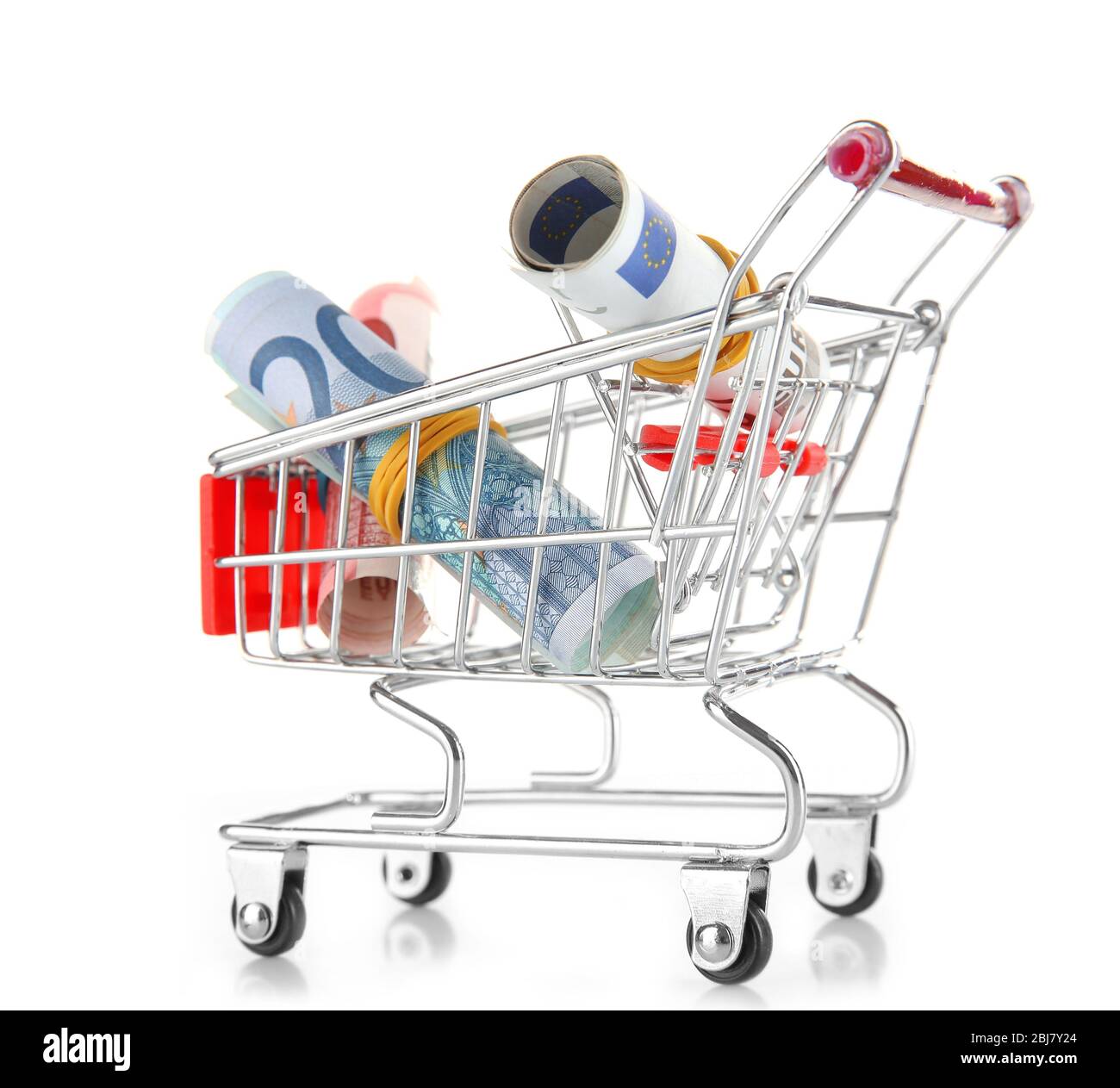 Small shopping trolley with euros banknotes isolated on white Stock ...
