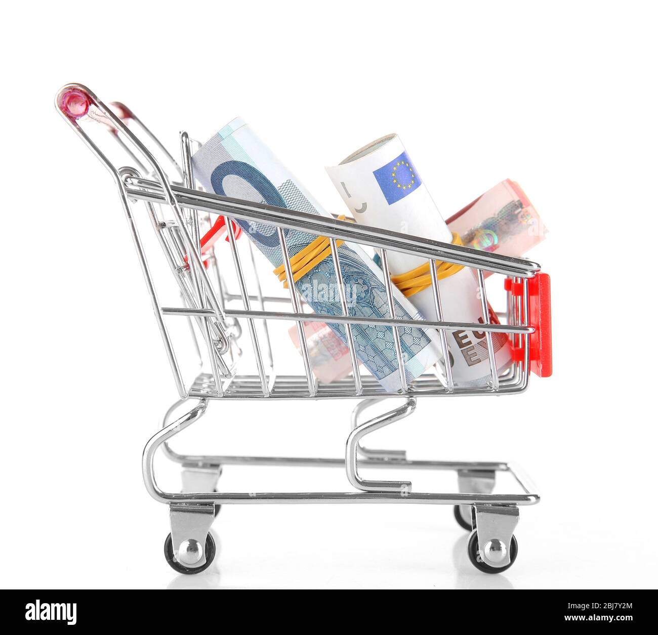 Small shopping trolley with euros banknotes isolated on white Stock ...