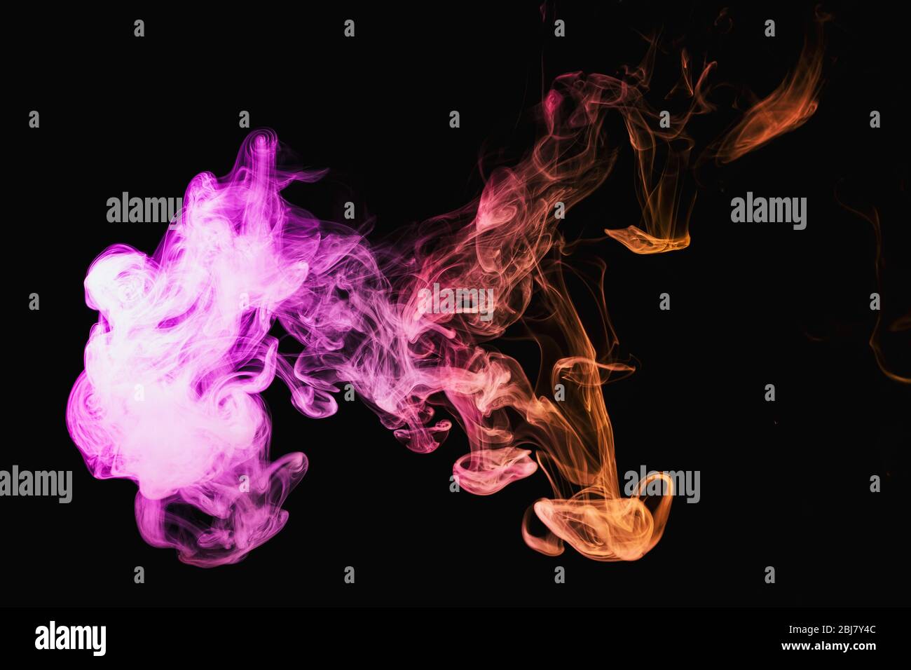Smoke of pattern pink and red on a dark isolated background. Scary and ...