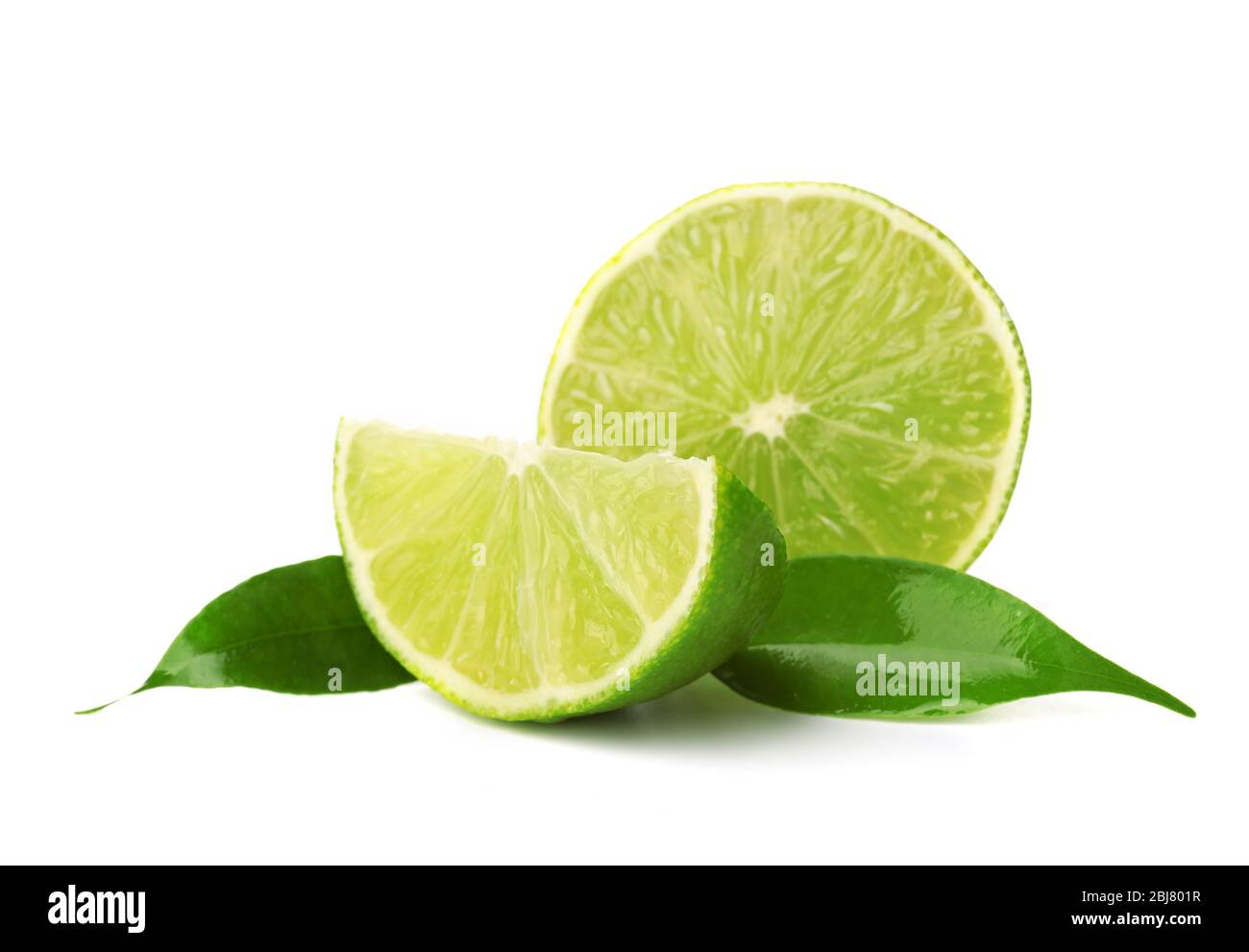 Slices of lime, isolated on white Stock Photo - Alamy