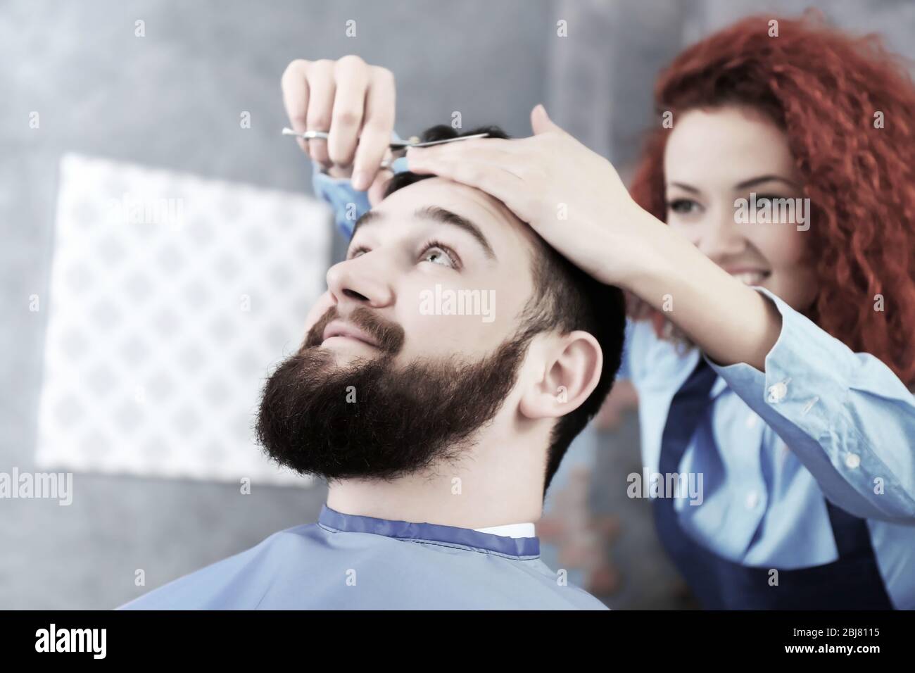 Handsome man visiting barber shop Stock Photo - Alamy