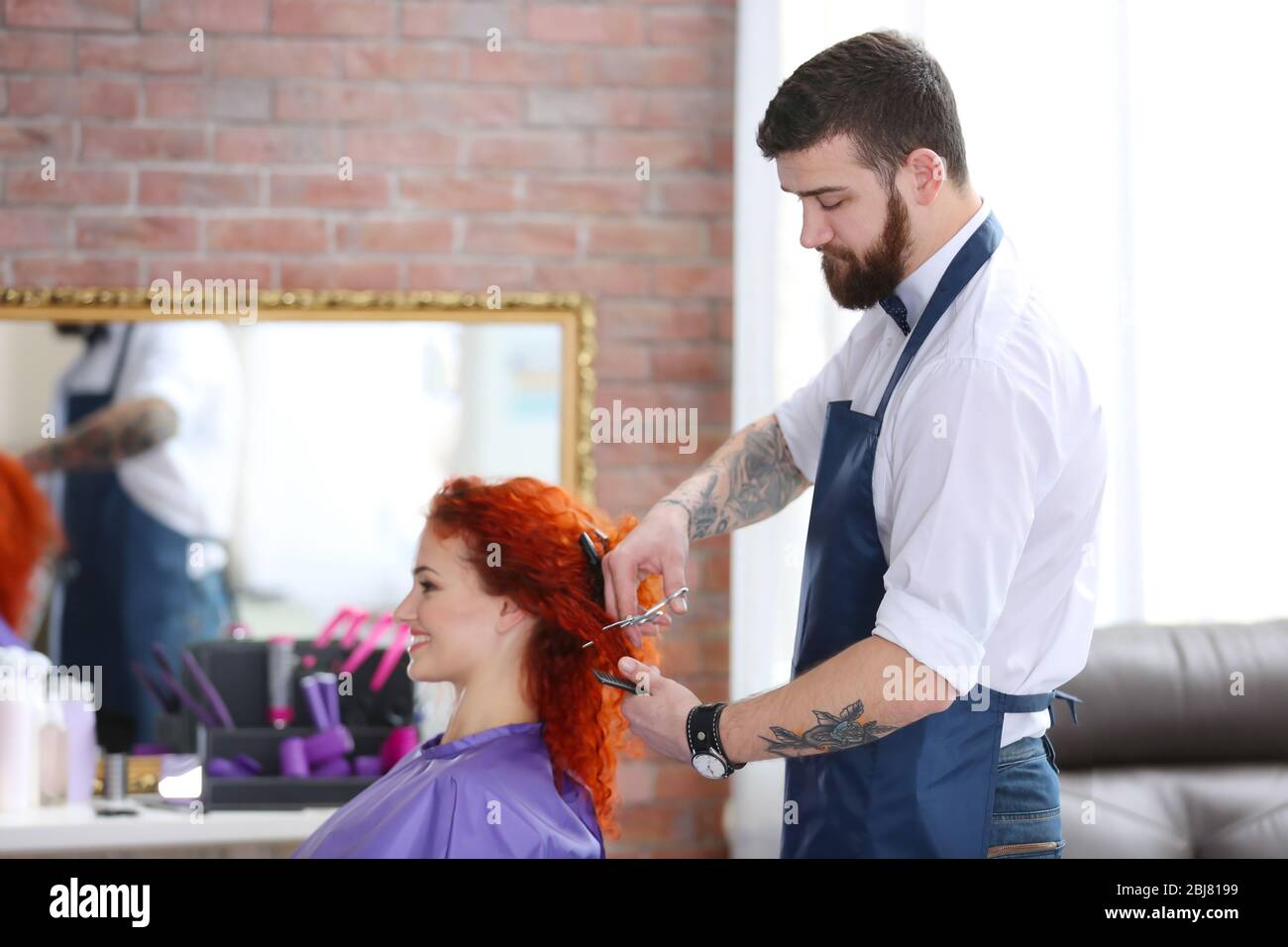 Stylish barber making new haircut Stock Photo - Alamy