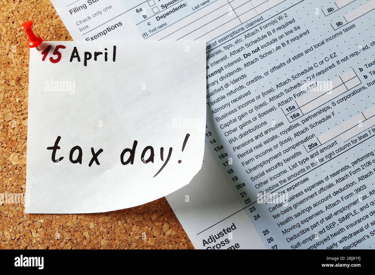 Tax day reminder pinned on the board, close up Stock Photo - Alamy