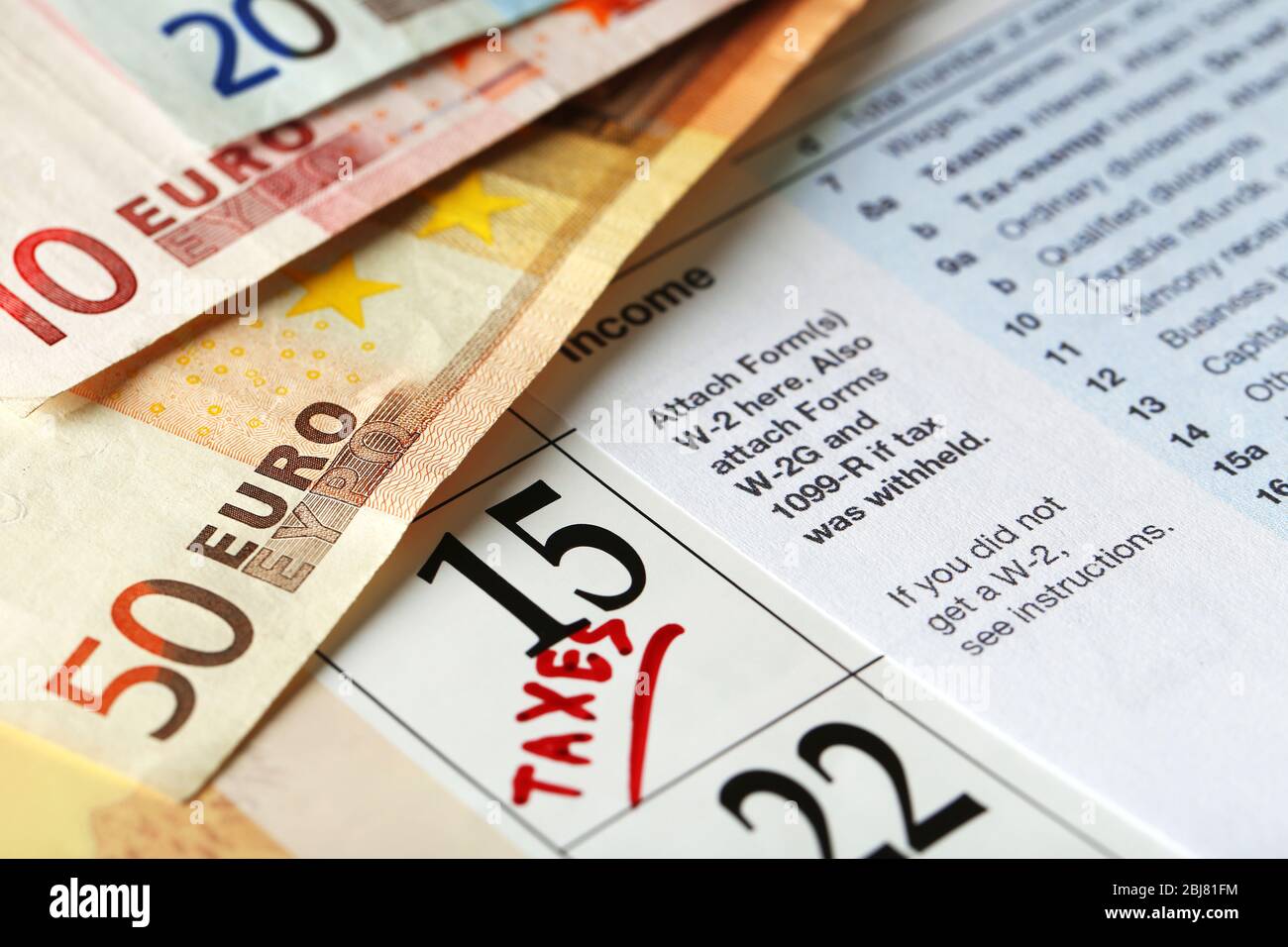 Taxes mark in the calendar with euro bills, close up Stock Photo - Alamy