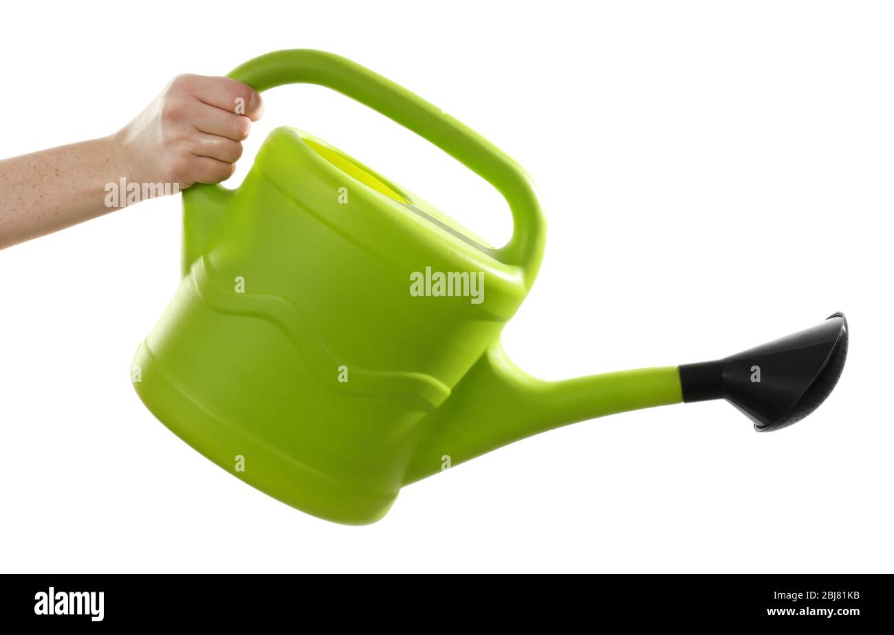 Female hand holding a simple green plastic watering can with black ...