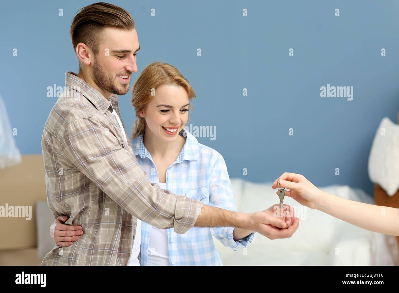 Woman taking keys from new hi-res stock photography and images - Alamy