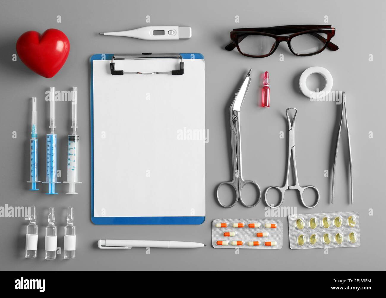 Doctor table with medical items and medicines, top view Stock Photo - Alamy
