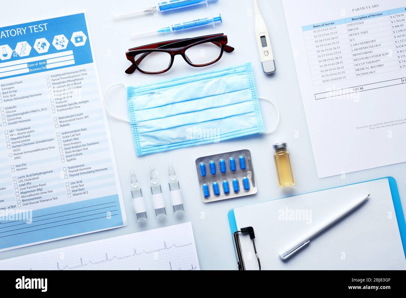Doctor table with medical items, top view Stock Photo - Alamy