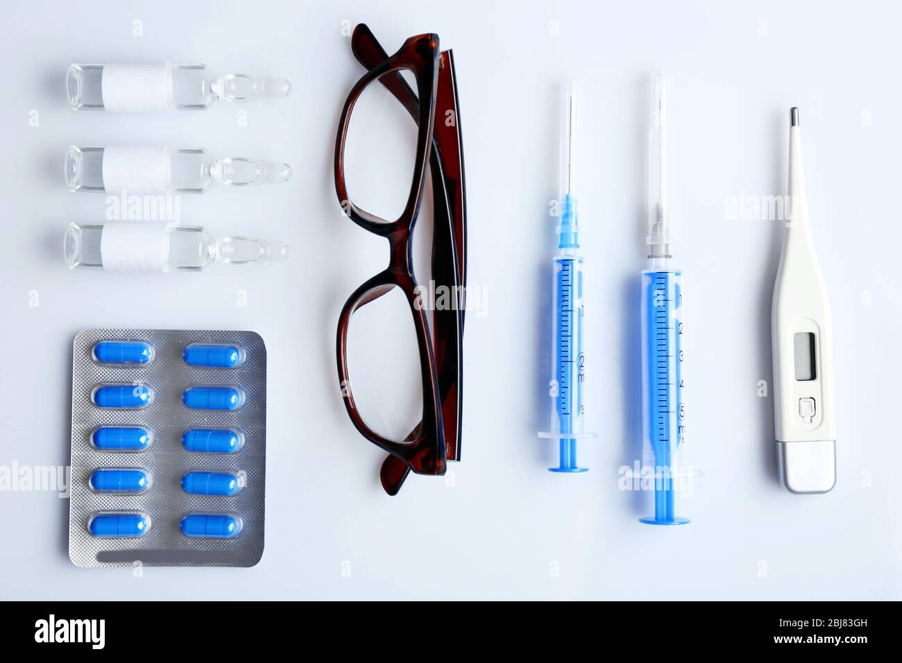 Doctor table with medical items, top view Stock Photo - Alamy