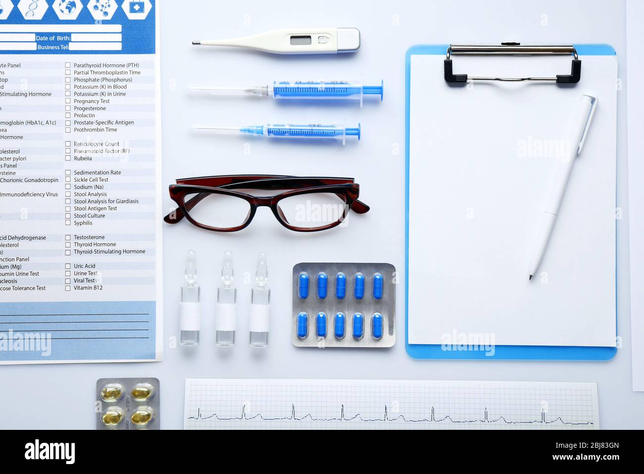 Doctor table with medicines, glasses and clipboard, top view Stock ...