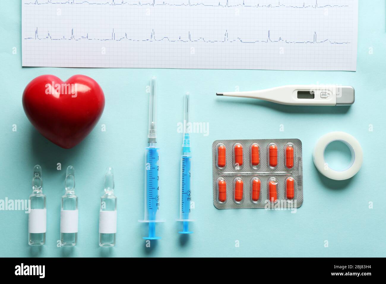 Doctor table with medical items and pills, top view Stock Photo - Alamy