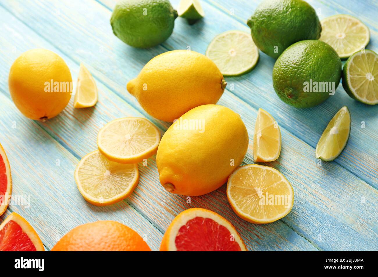 Juicy composition of citrus fruits on wooden background, close up Stock ...