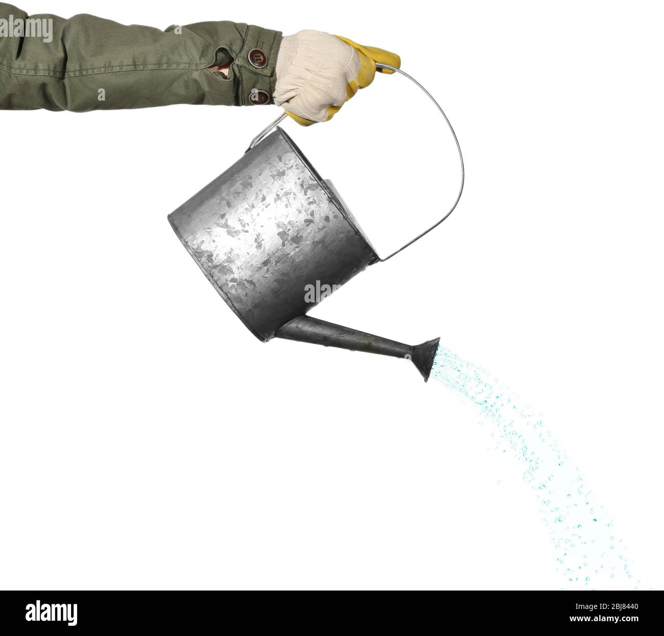 Hand pouring from metal watering can, isolated on white Stock Photo - Alamy