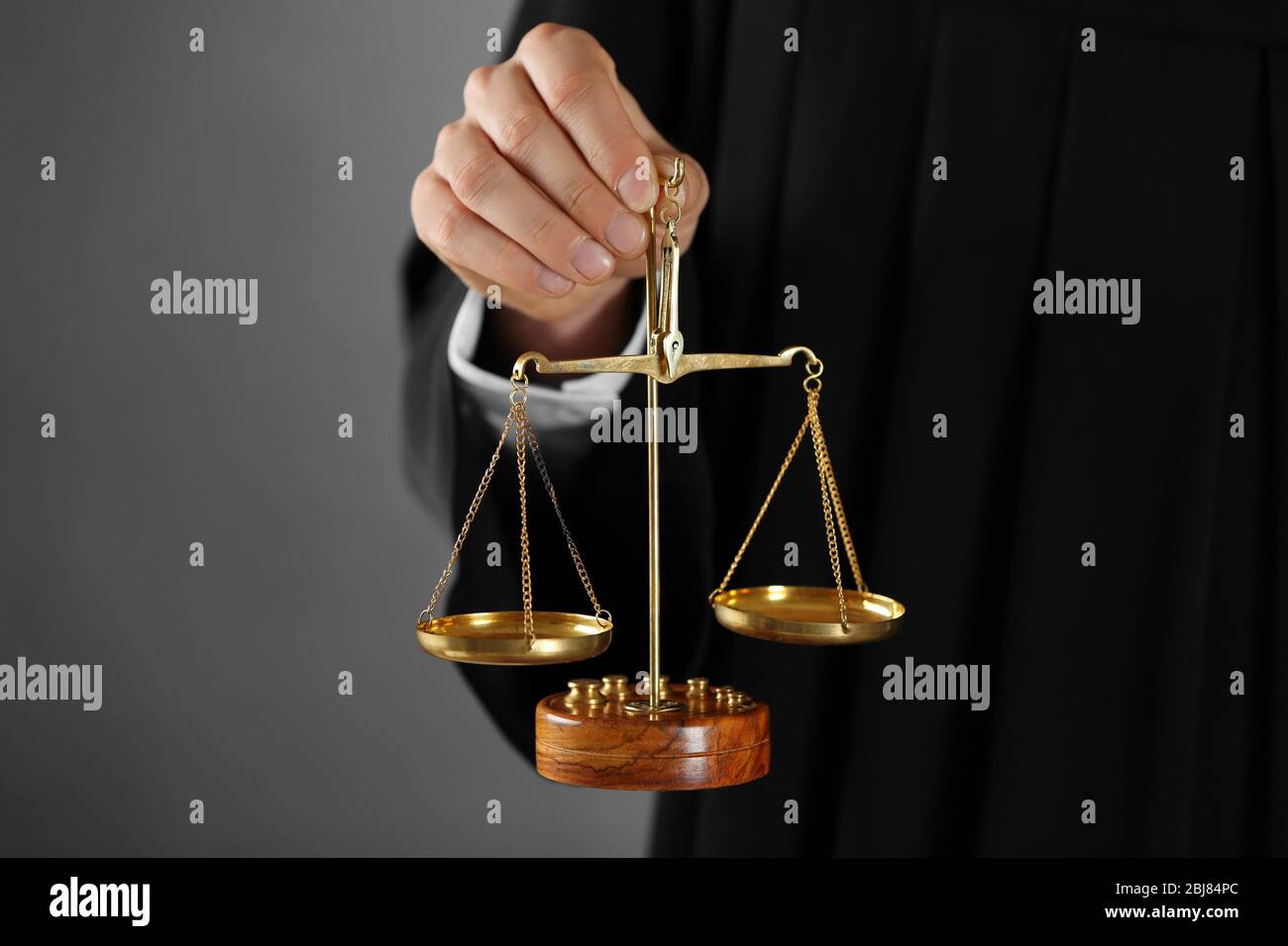 Man holding scales of justice hi-res stock photography and images - Alamy