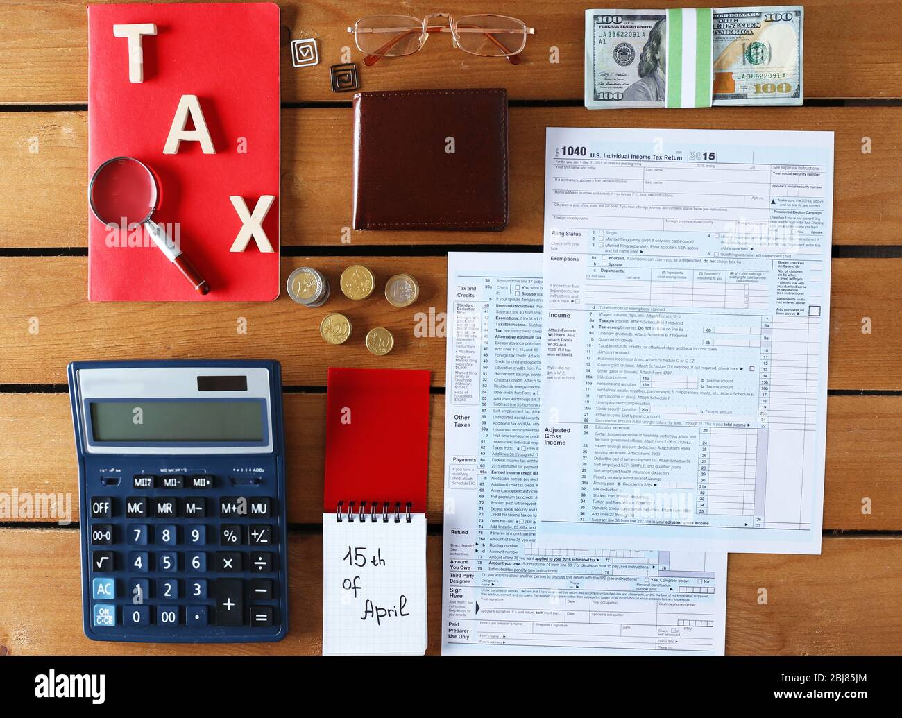 Individual income tax return, form 1040 with calculator and notebook ...