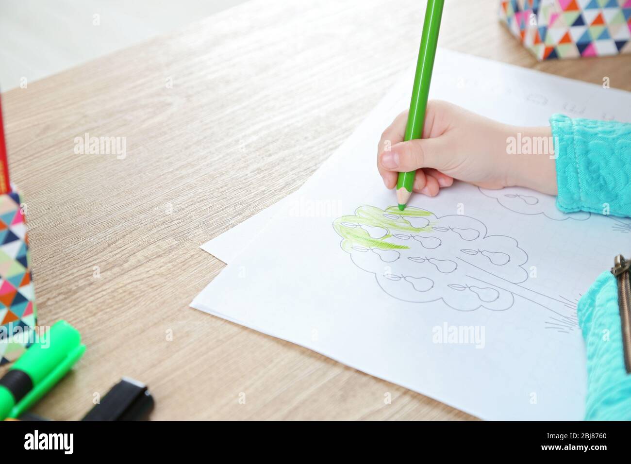 Little girl learning to draw at the table Stock Photo - Alamy