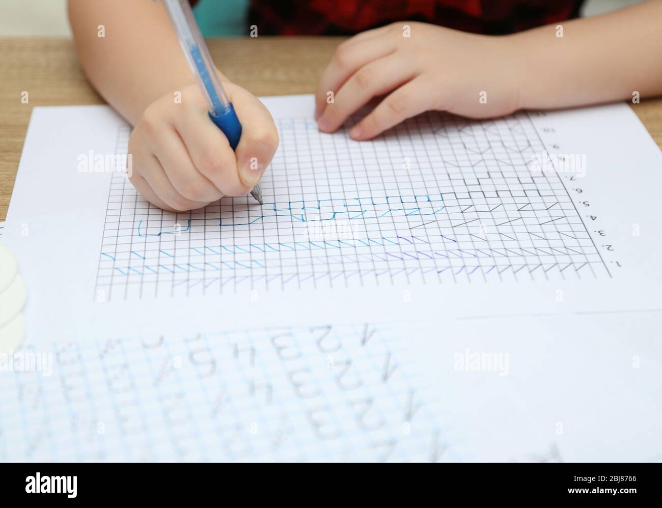 Little girl learning to draw at the table Stock Photo - Alamy