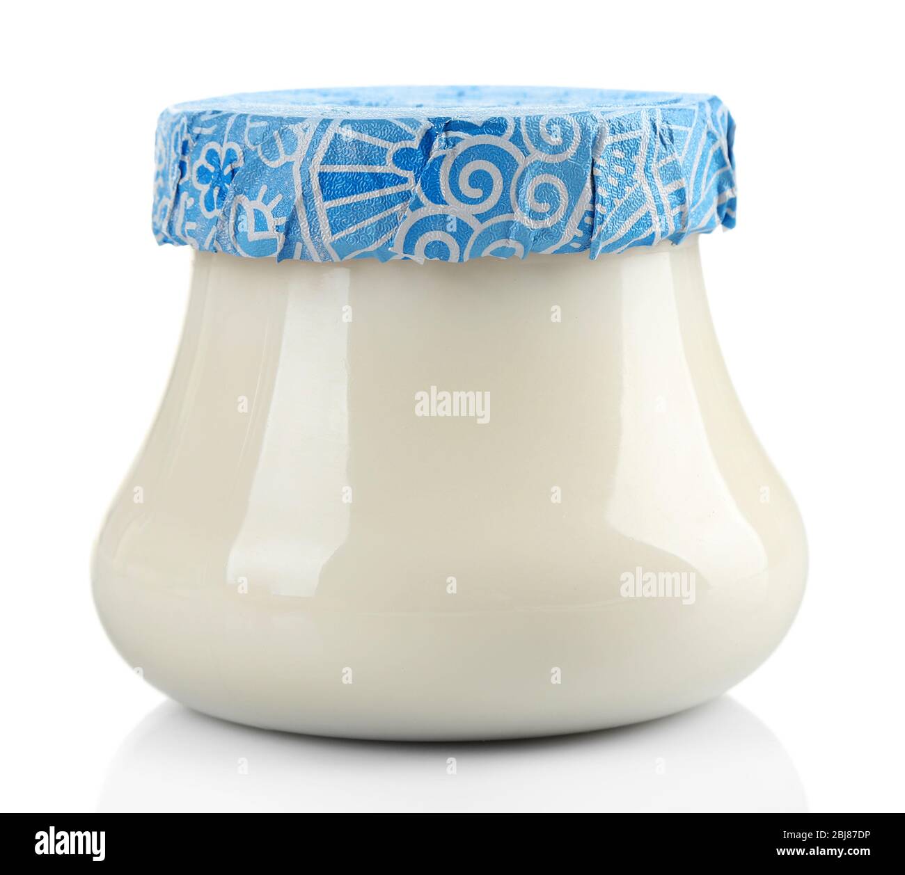 Thick cream in bottle, isolated on white Stock Photo - Alamy