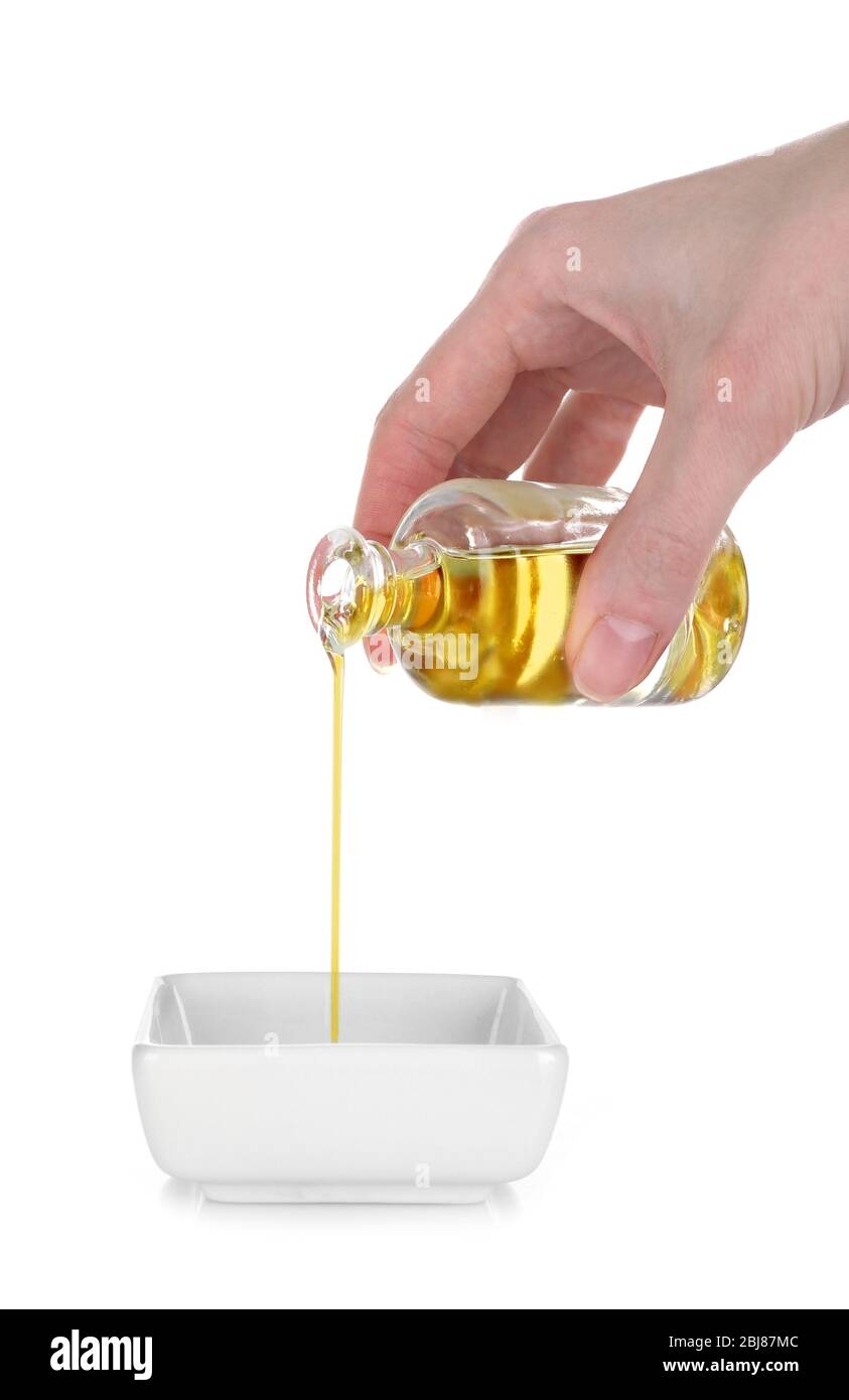 Woman hand pouring spa oil, isolated on white Stock Photo - Alamy