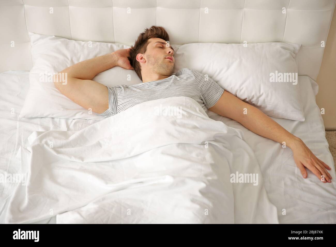 Attractive male model lying alone hi-res stock photography and images ...