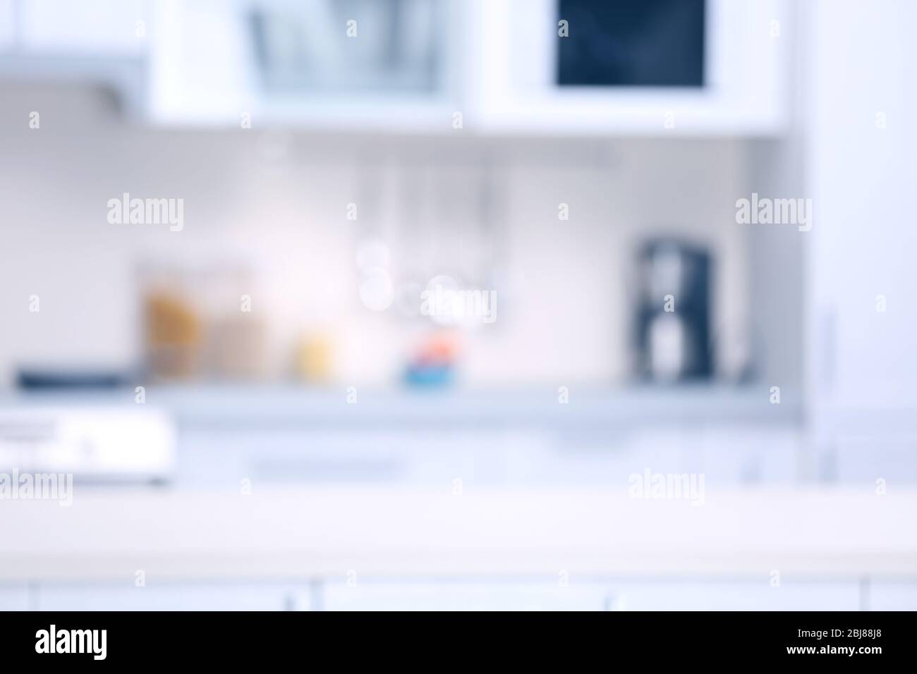 Blurred kitchen interior in light tones with white furniture Stock ...