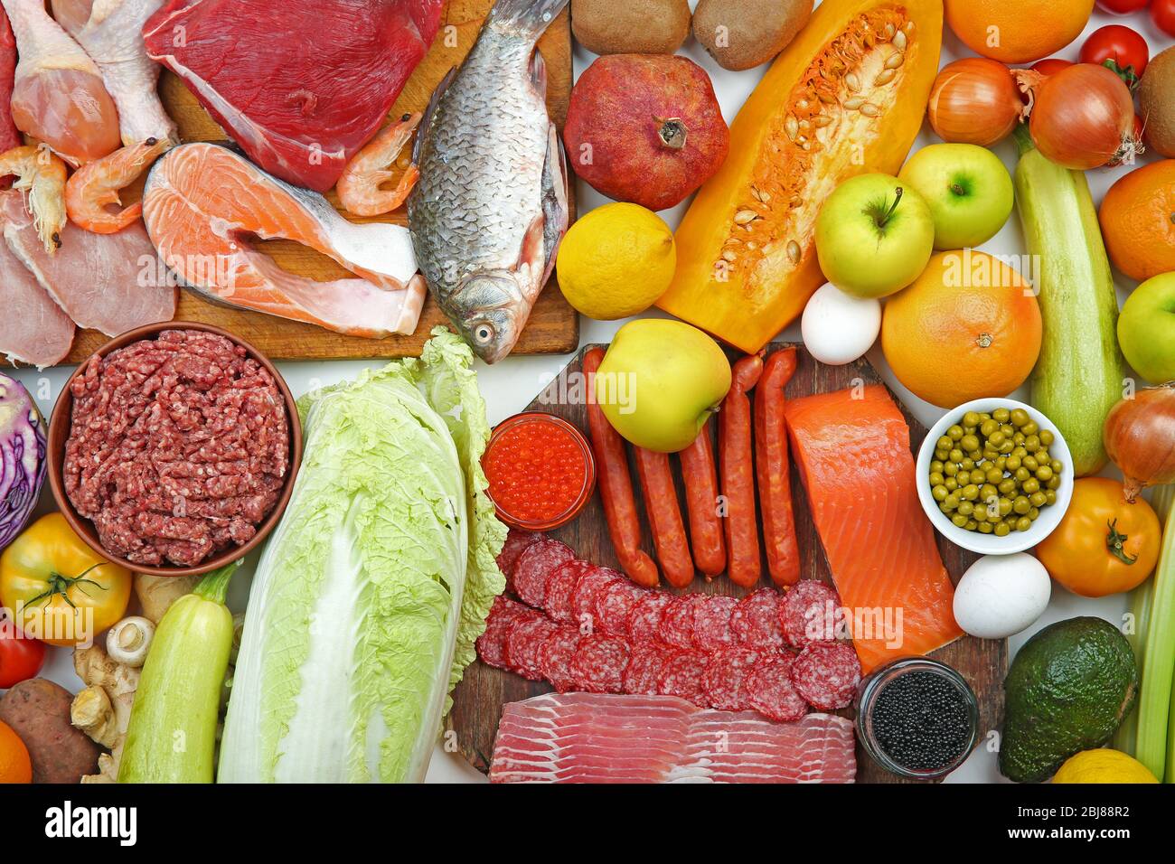 Various food products on wooden boards Stock Photo - Alamy