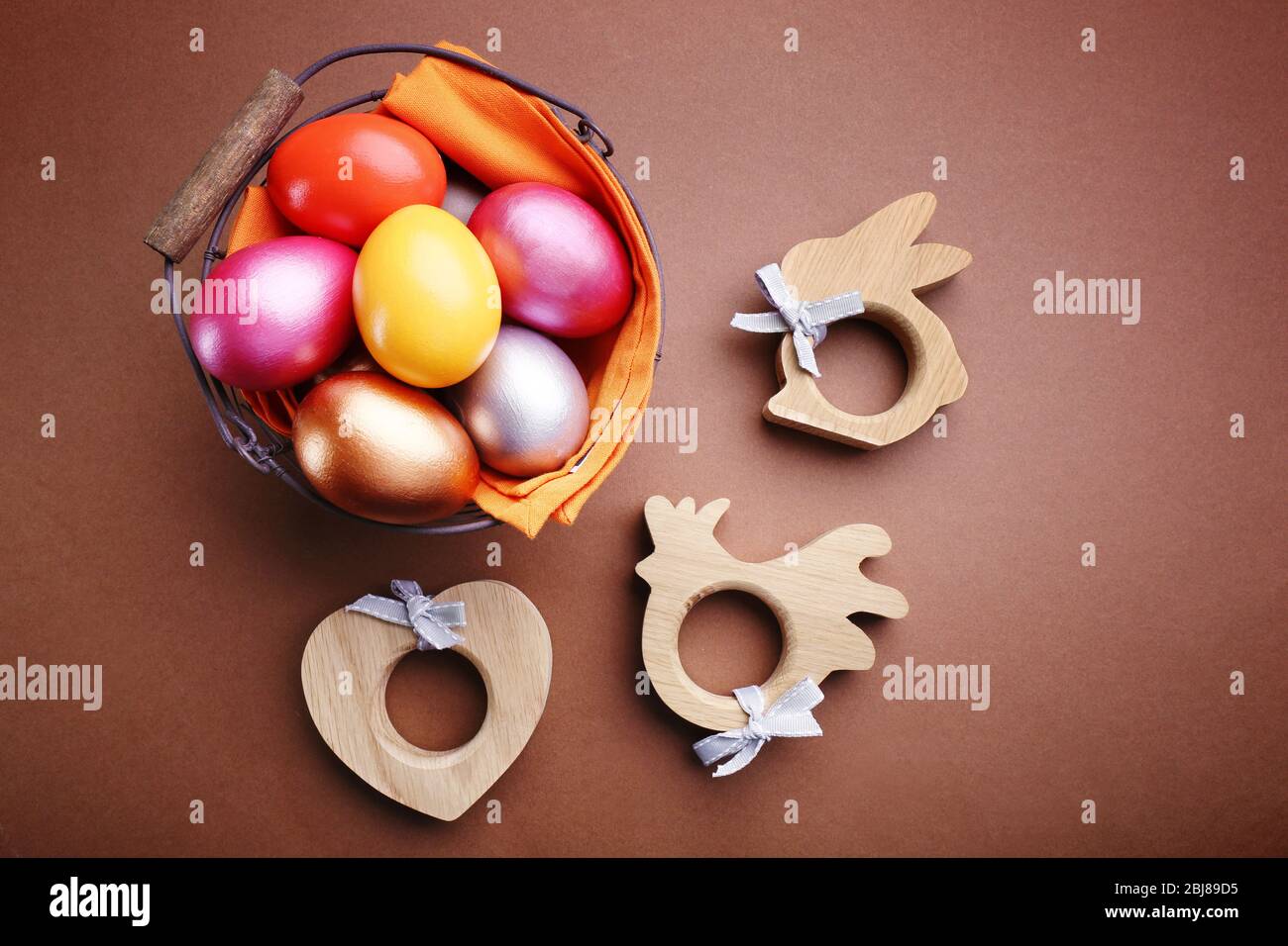 Easter eggs in a basket, top view Stock Photo - Alamy
