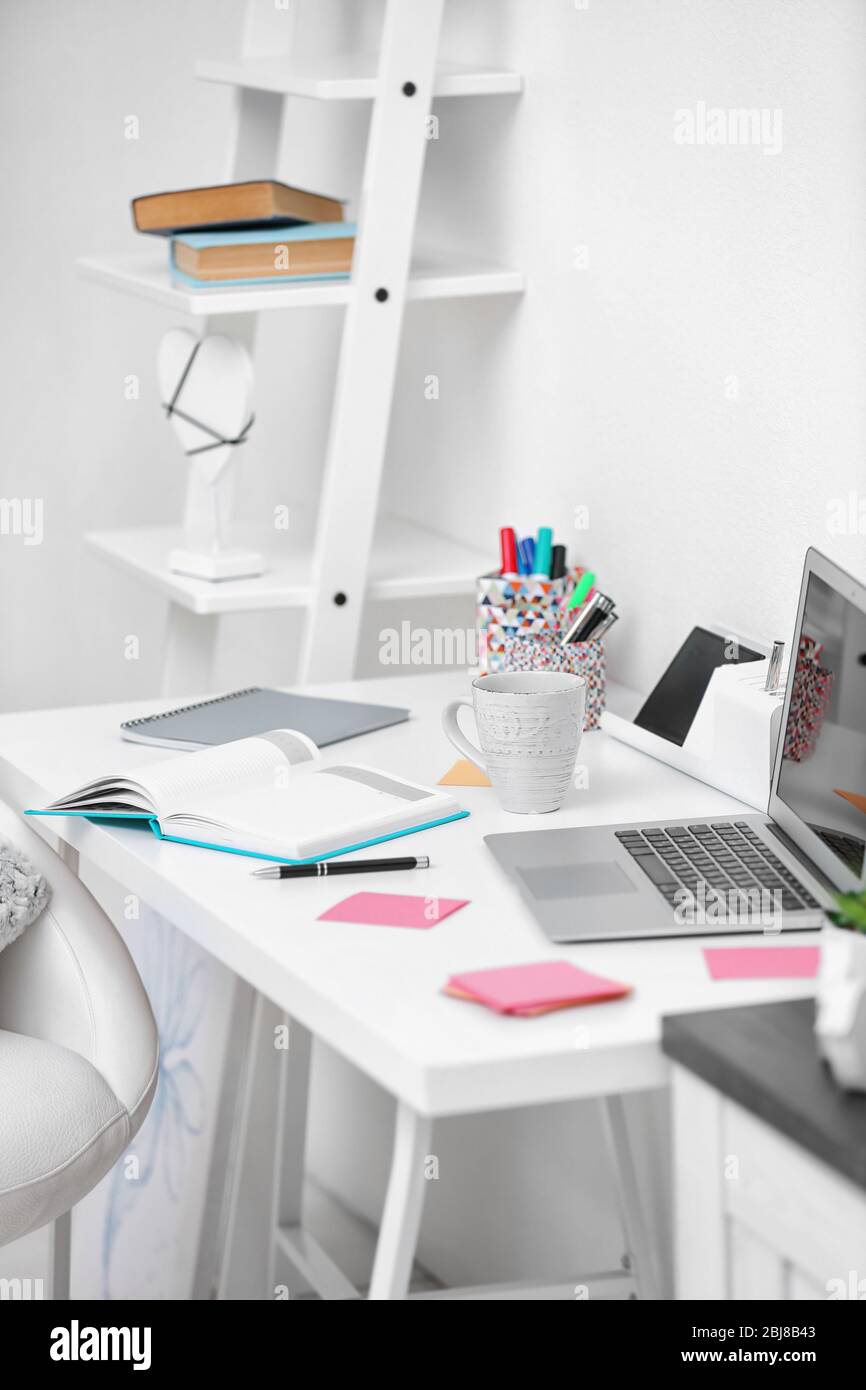 Stylish bright workplace in office Stock Photo - Alamy