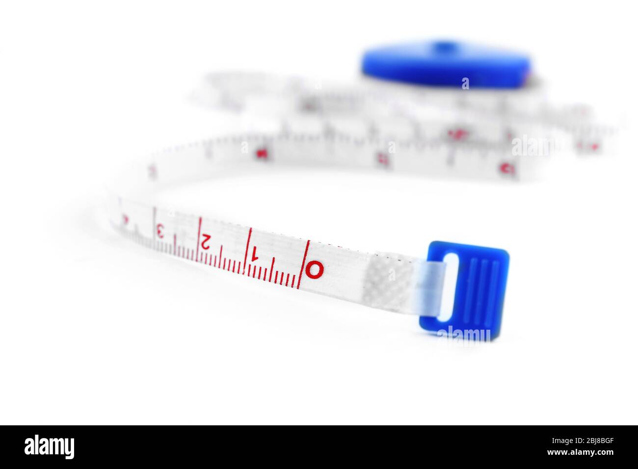 Measuring tape isolated on white Stock Photo - Alamy
