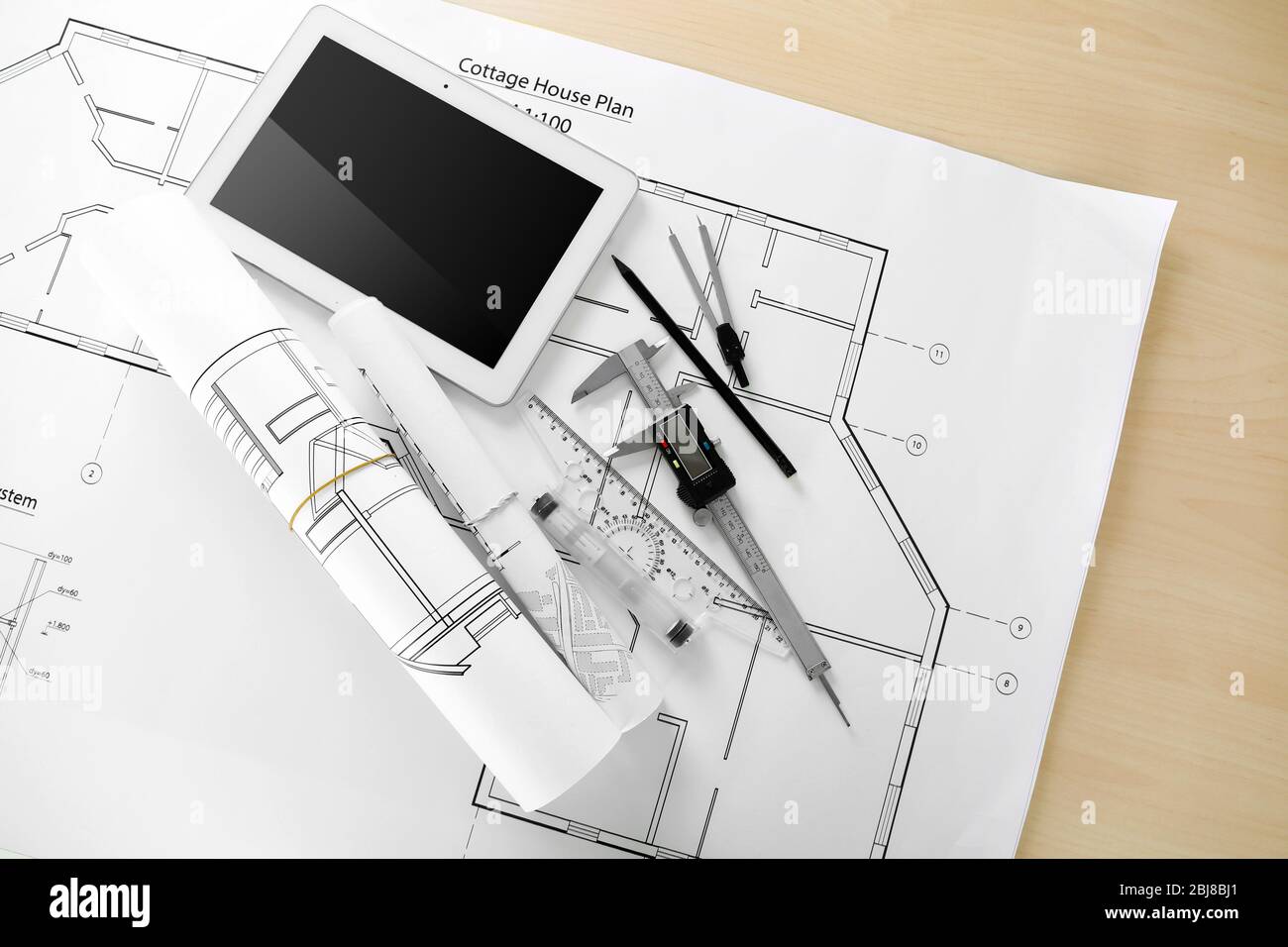 Construction drawings and other tools on wooden table, top view Stock ...