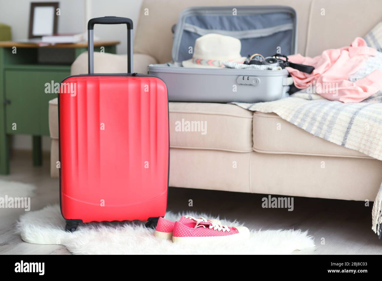 Large red polycarbonate suitcase, close up Stock Photo - Alamy