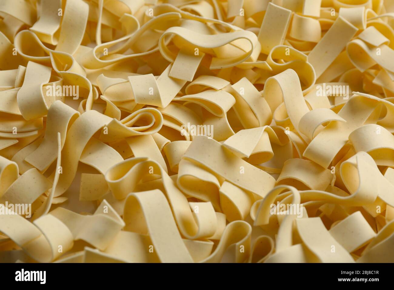 Italian dry pasta background, close up Stock Photo - Alamy