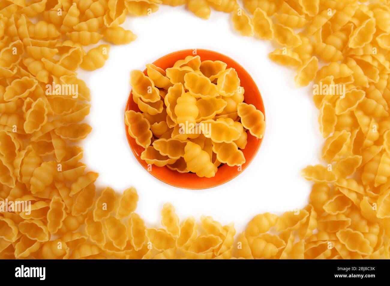 Pile of Italian dry pasta in a bowl, top view Stock Photo - Alamy