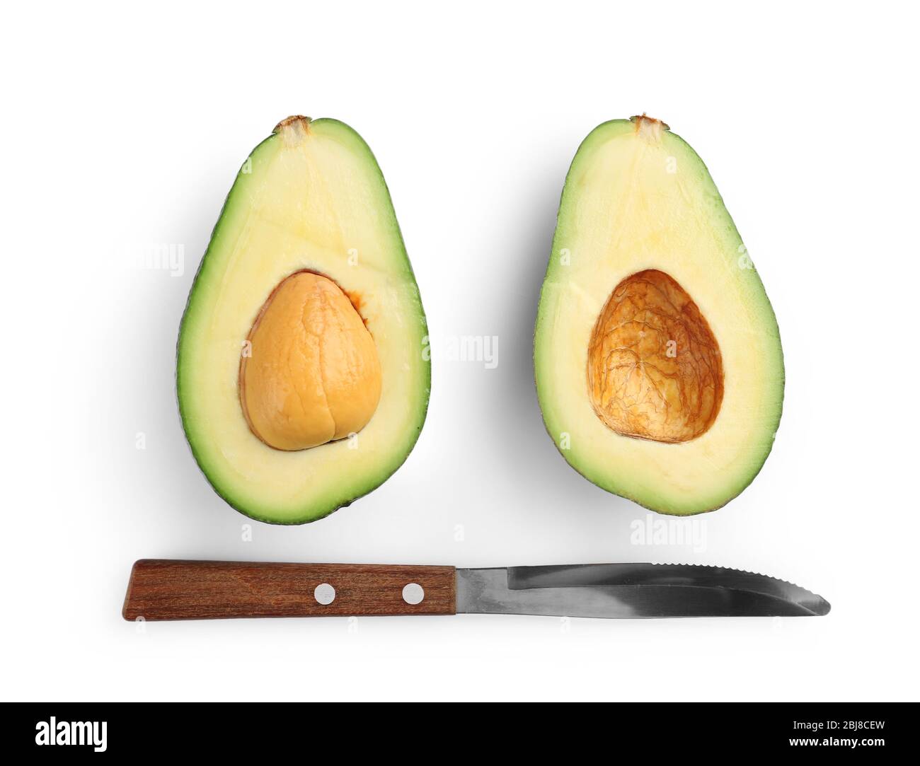 Avocado and knife isolated on white Stock Photo - Alamy