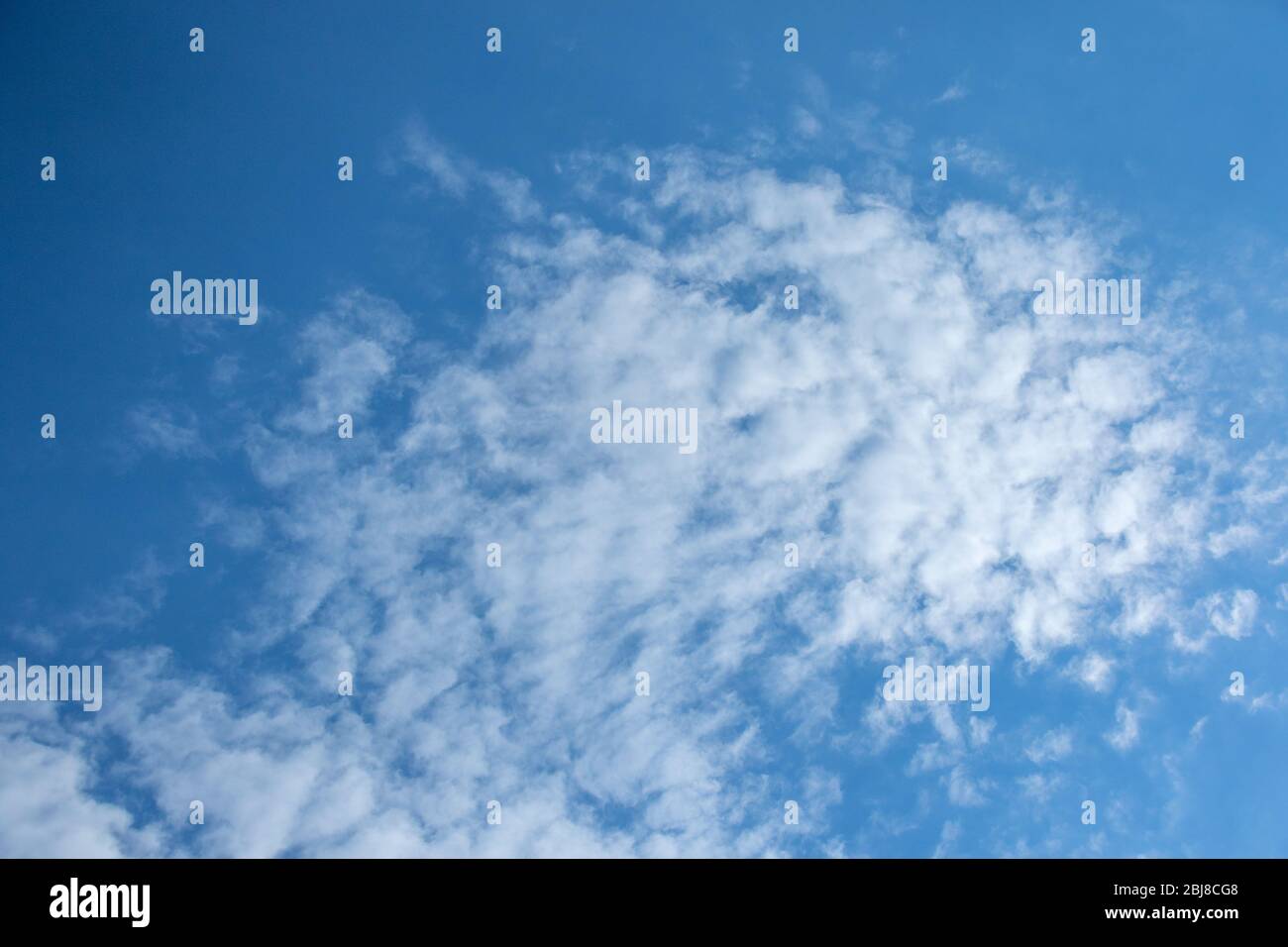 White cloud formation isolated on a clear blue winter sky image for ...