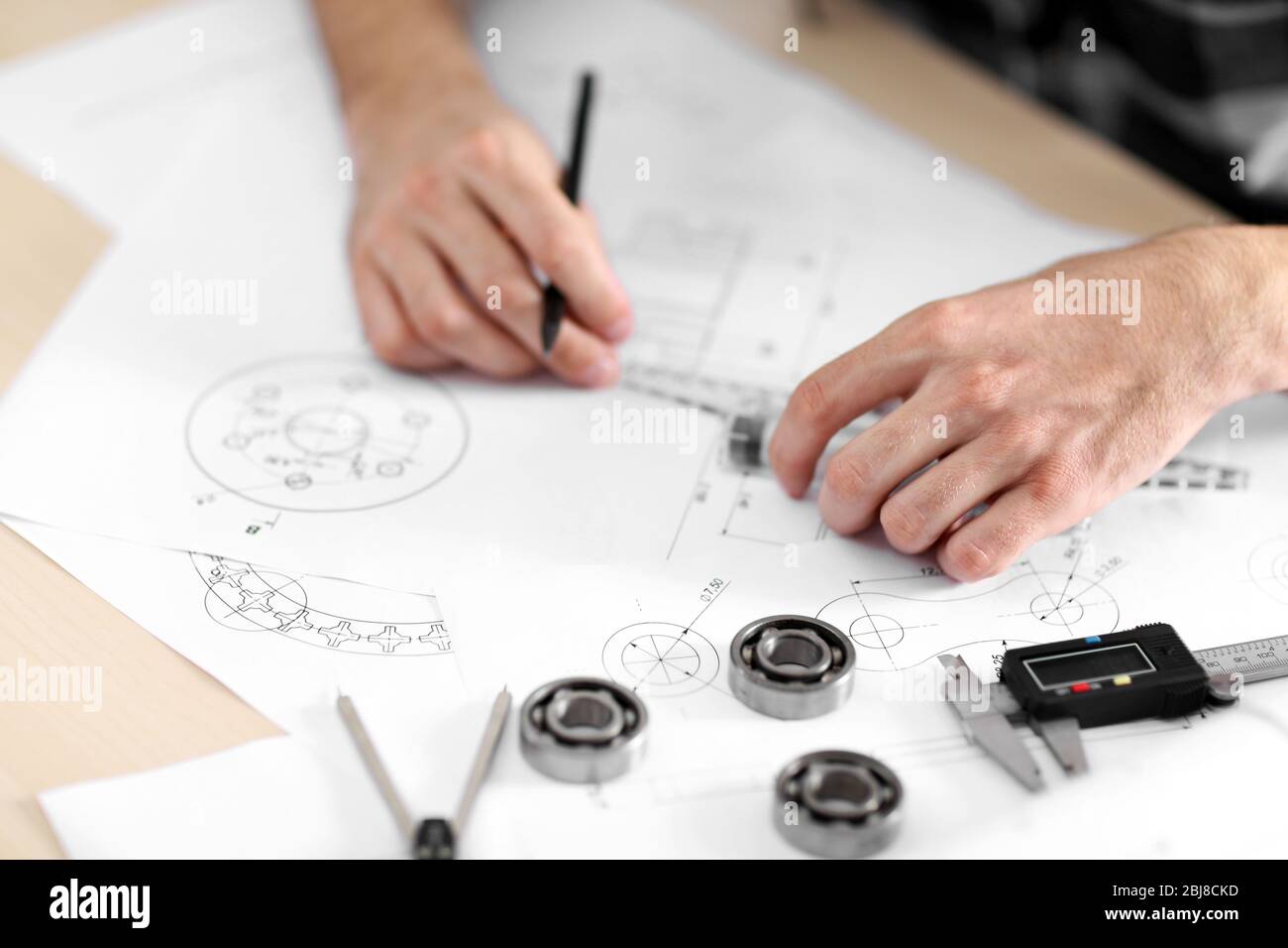 Professional engineer working with blueprints Stock Photo - Alamy