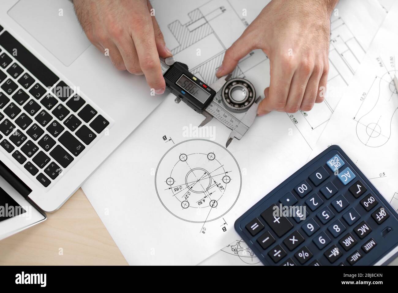 Professional engineer working with blueprints Stock Photo - Alamy