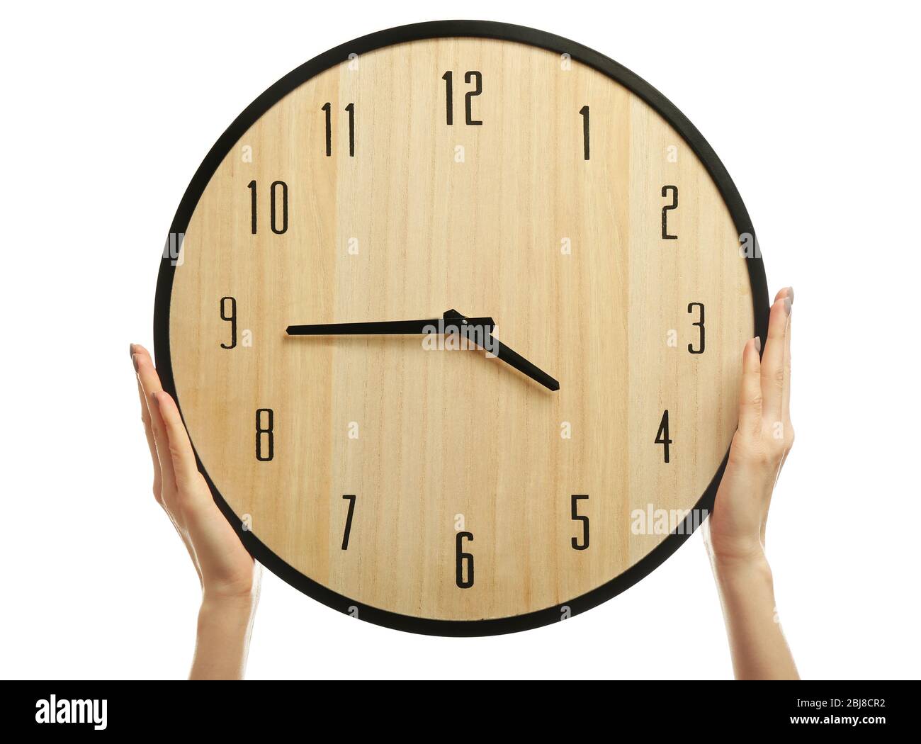 Woman's hands holding a clock, isolated on white Stock Photo - Alamy