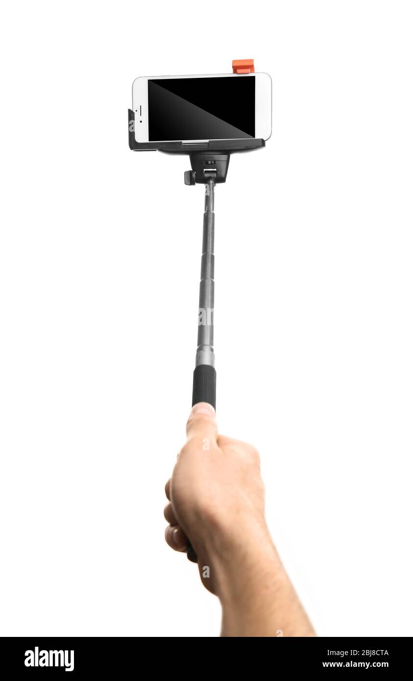 Hand holding stick for making photo with mobile phone, isolated on ...