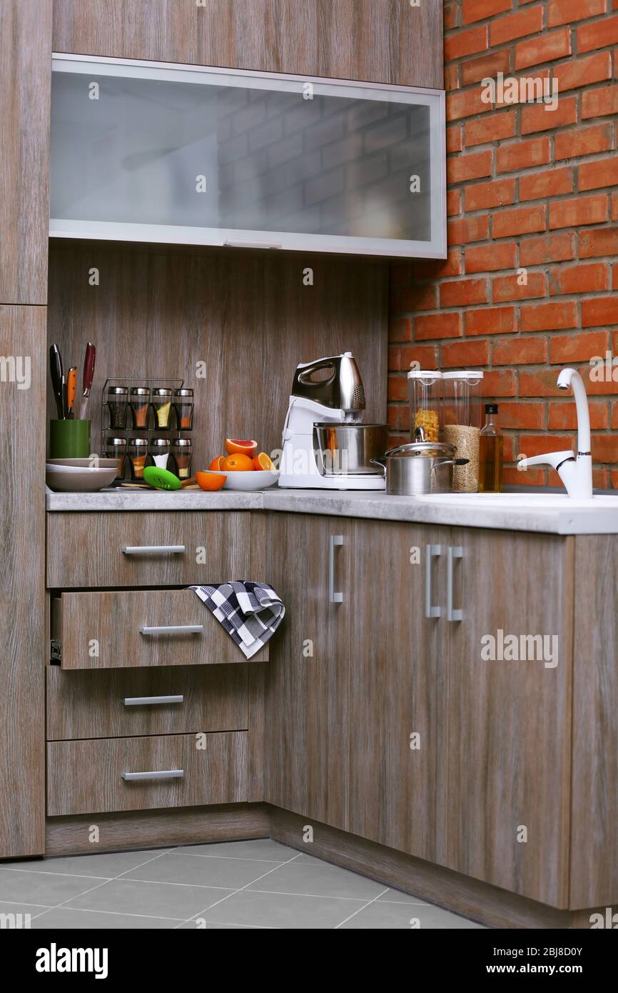 Modern kitchen furniture with sink, mixer and utensils Stock Photo - Alamy