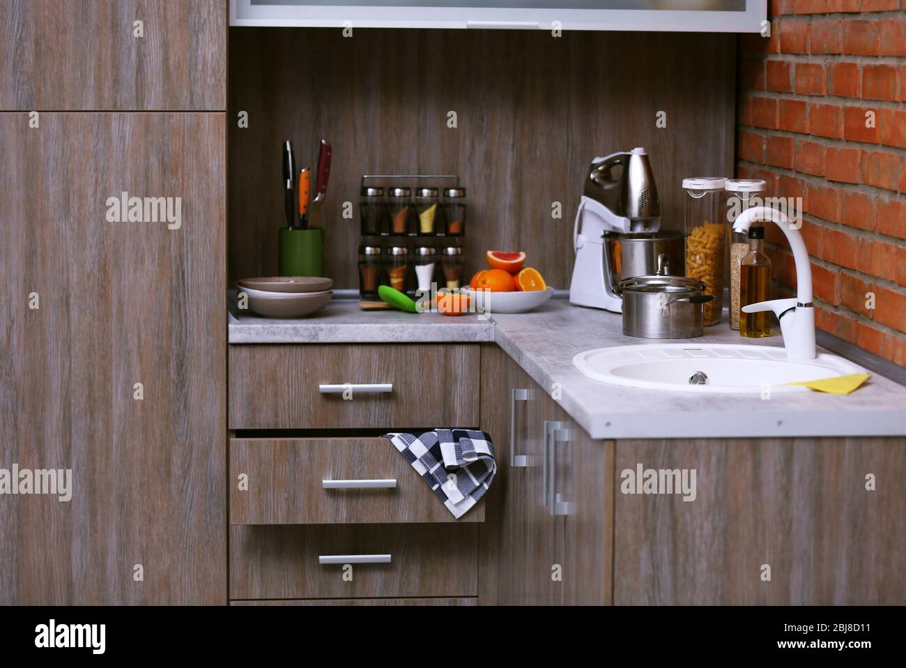 Modern kitchen furniture with sink, mixer and utensils Stock Photo - Alamy