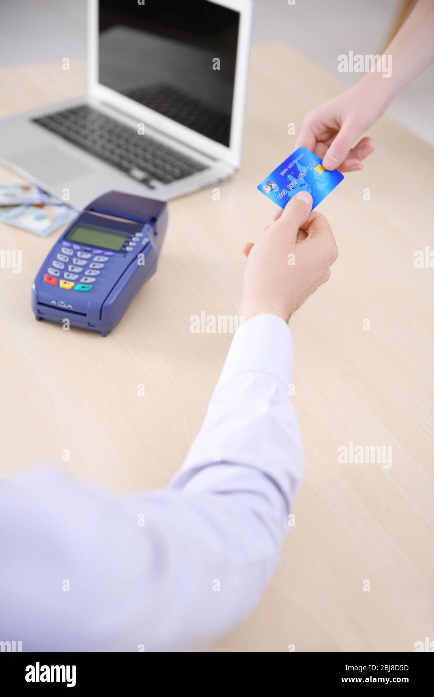 Payment operation with credit card and terminal Stock Photo - Alamy