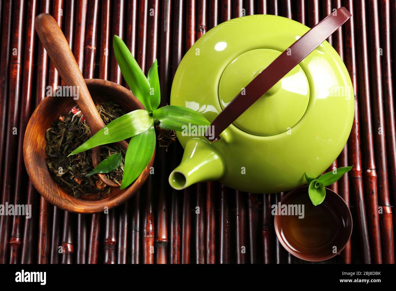 Green tea with ceramic utensils on bamboo background Stock Photo - Alamy