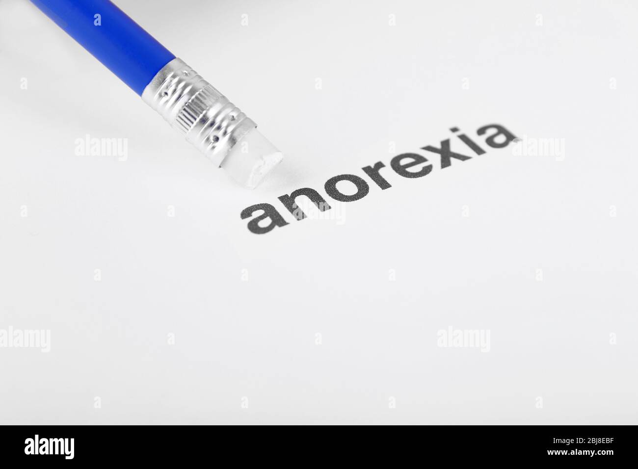 Anorexia word with pencil eraser on white paper background Stock Photo ...