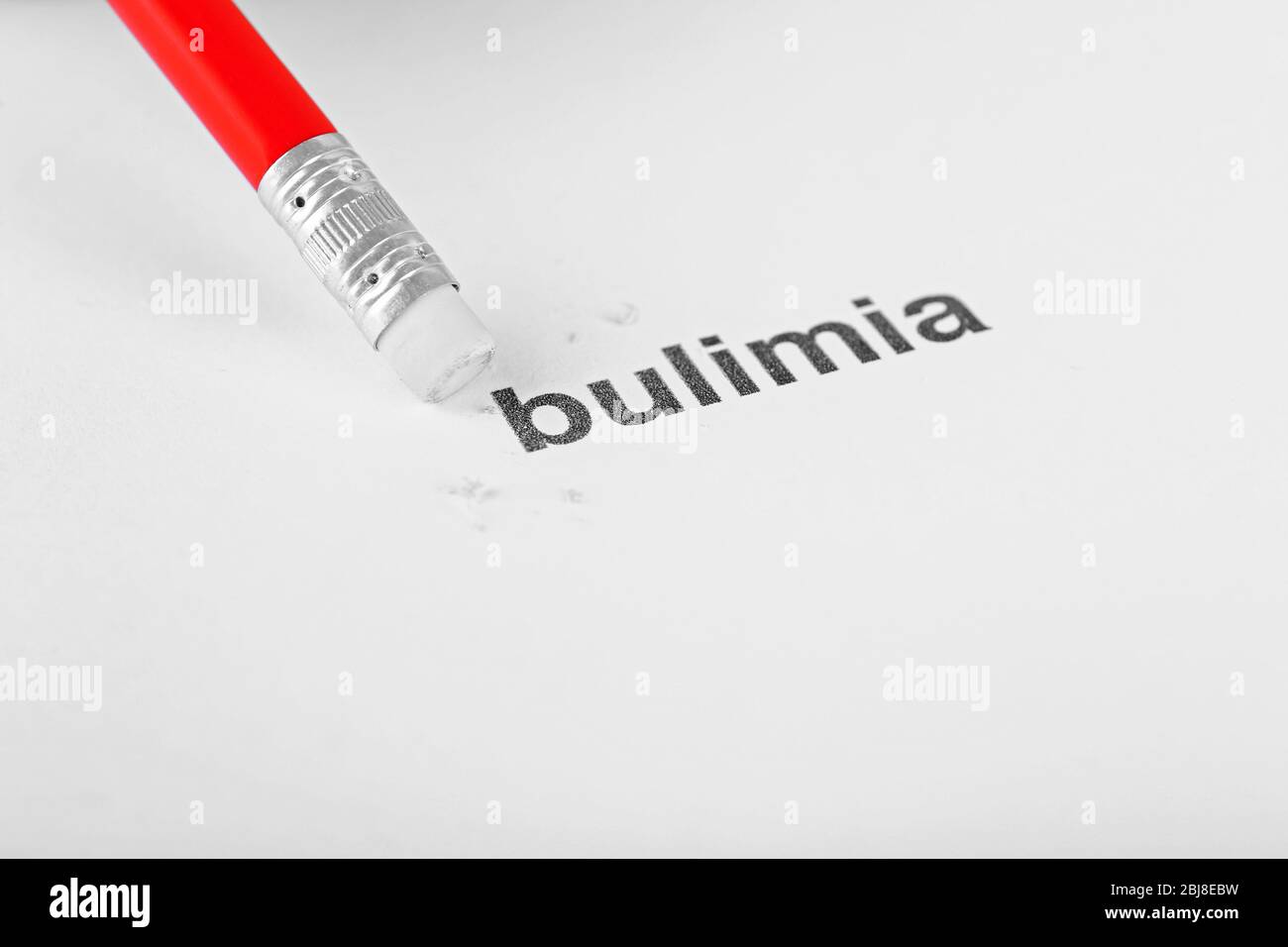 Bulimia word with pencil eraser on white paper background Stock Photo ...