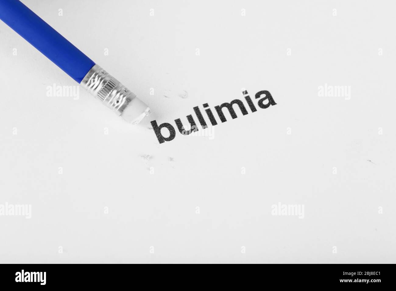 Bulimia word with pencil eraser on white paper background Stock Photo ...